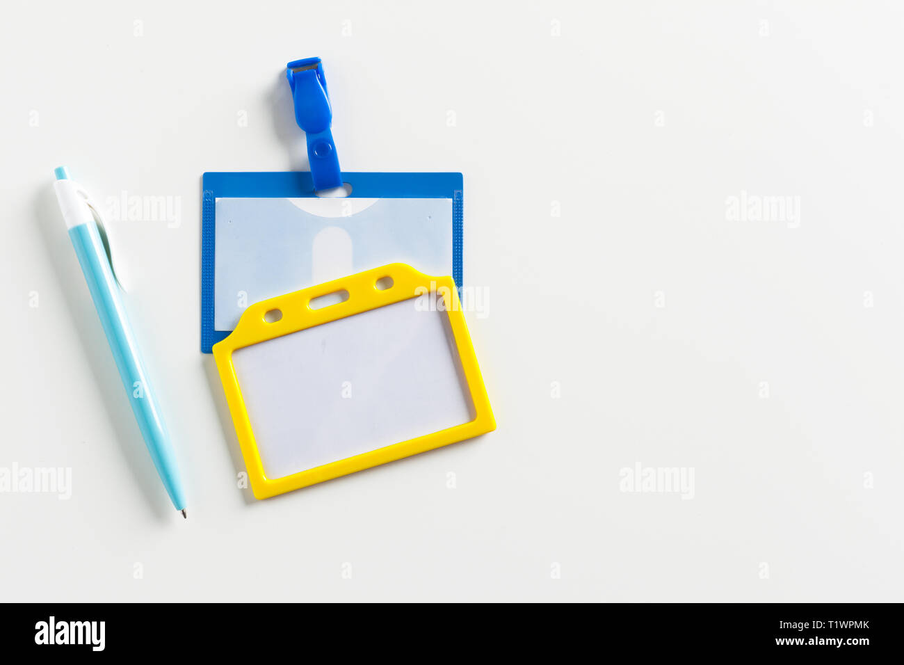 Name tag and a pen Stock Photo - Alamy