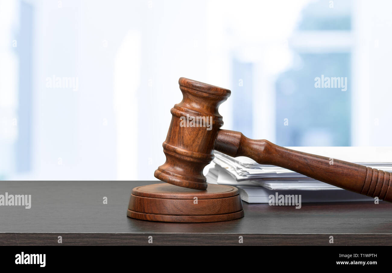 judge hammer on white paper and table Stock Photo - Alamy
