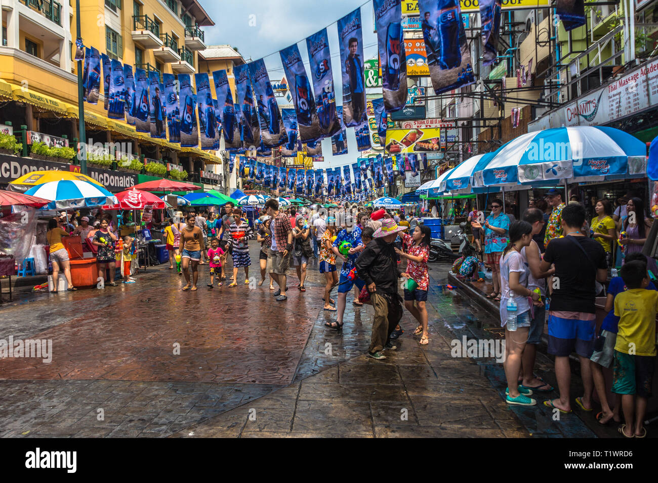 People with water guns celebrating the Thai new year of Songkran in ...