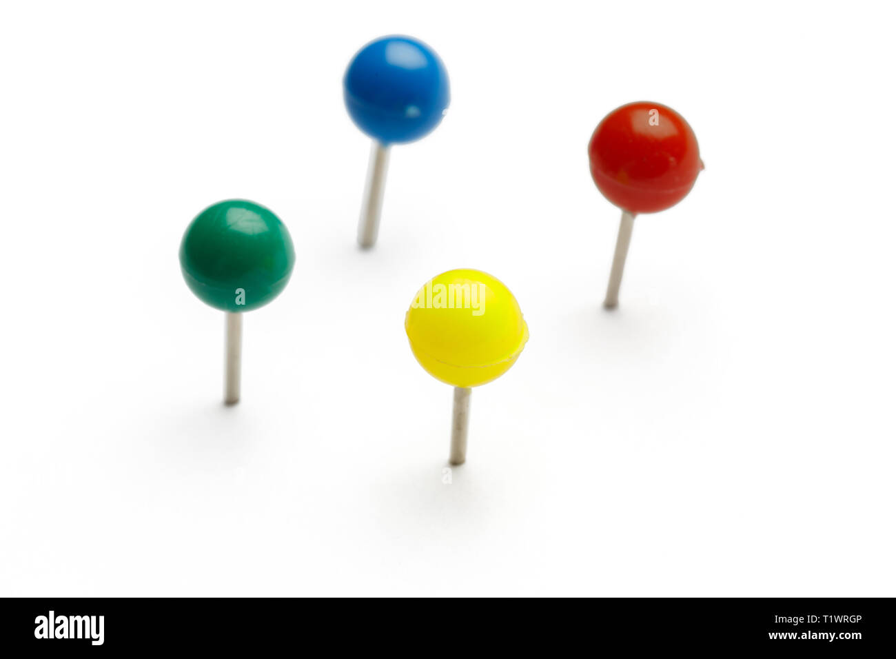 Push pins isolated on white background Stock Photo - Alamy