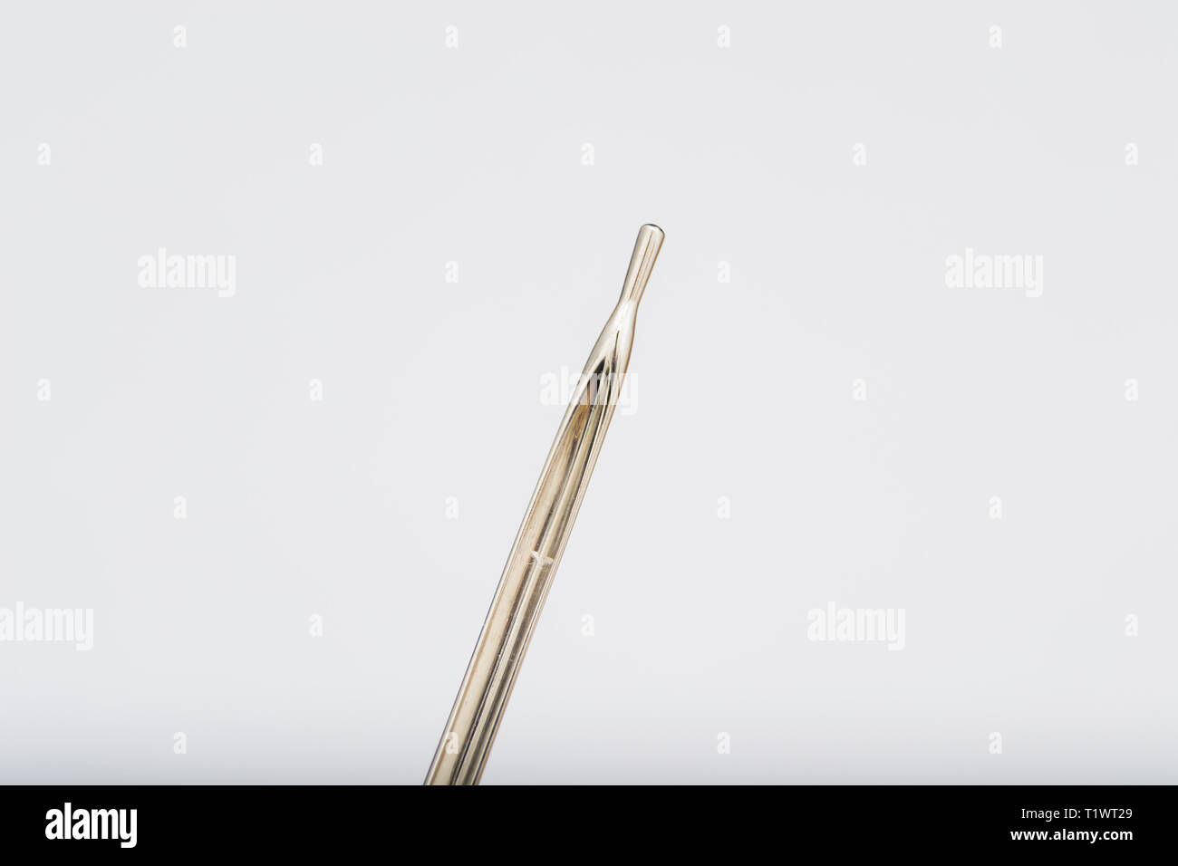 Buttoned probe for fistula on white background Stock Photo - Alamy