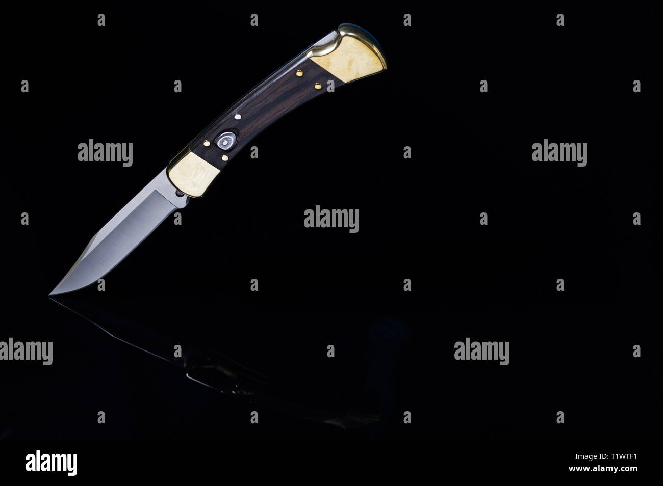 Hunting knife on a black background. Top view of the knife. Knife at an ...