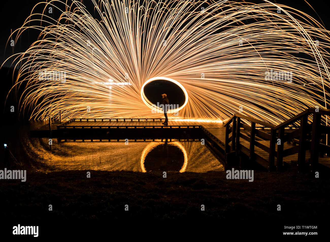 Burning steel wool as fireworks with fire splashes Stock Photo - Alamy