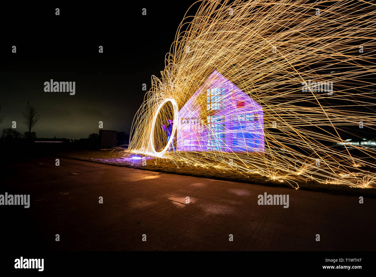 Burning steel wool as fireworks with fire splashes Stock Photo - Alamy