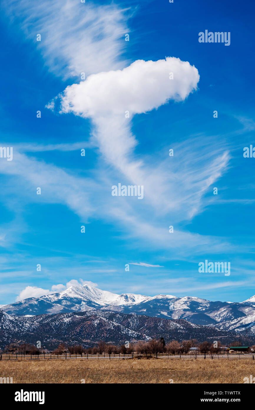 Unusual cloud formations against cobalt blue sky over Rocky Mountains ...