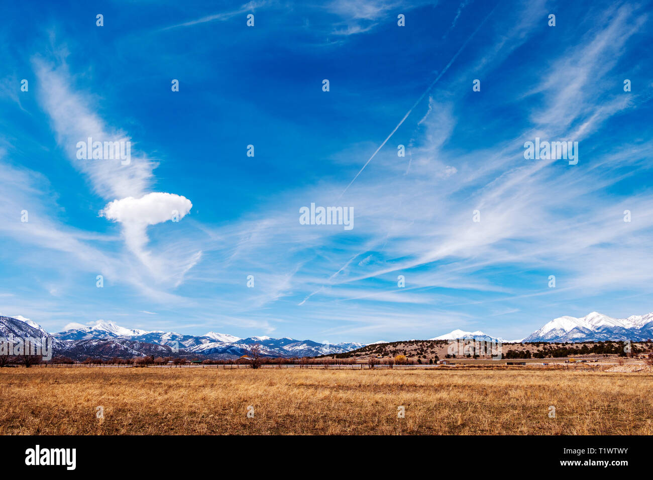 Unusual cloud formations against cobalt blue sky over Rocky Mountains ...