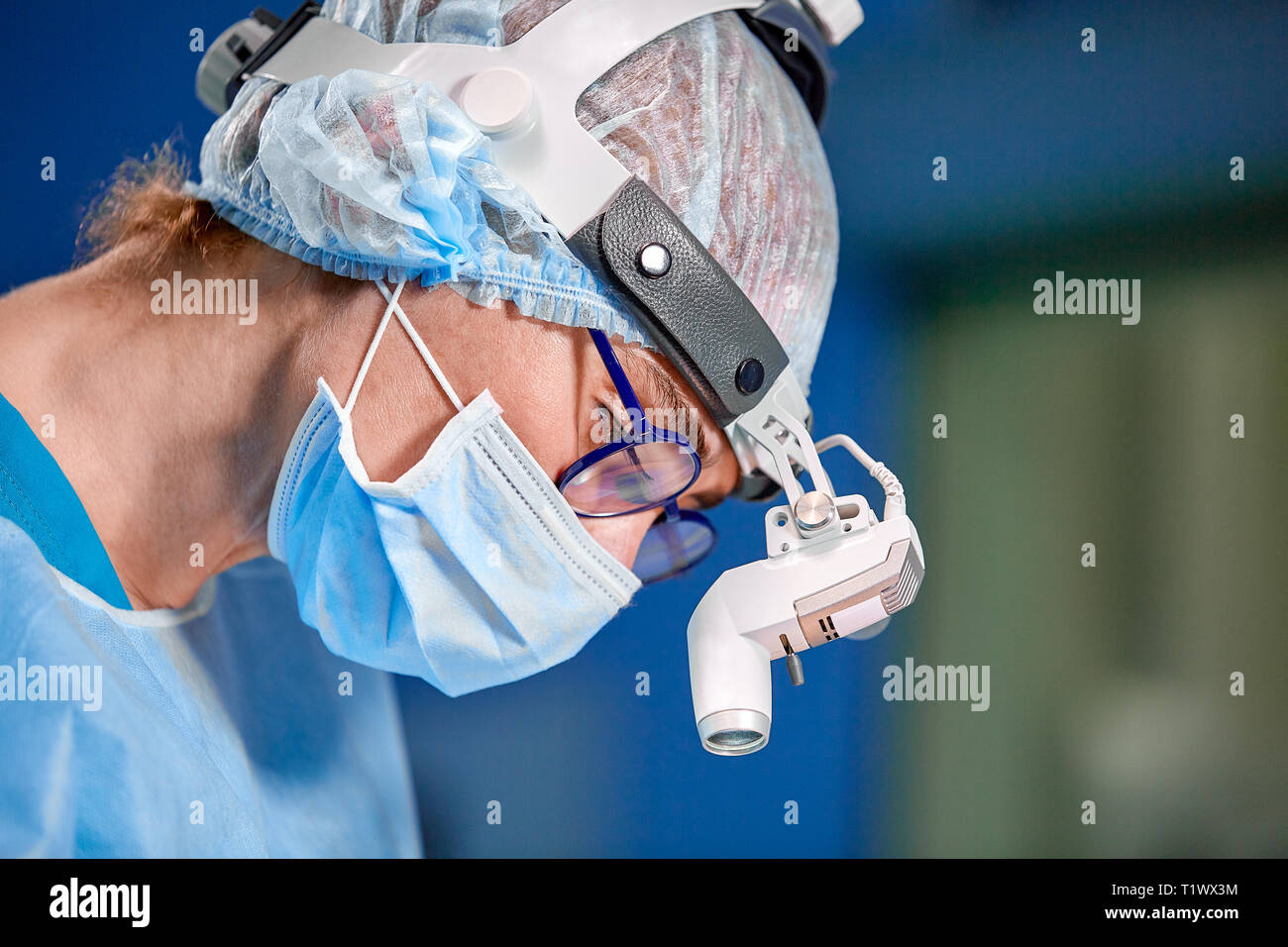 Close up portrait of female surgeon doctor wearing protective mask and ...