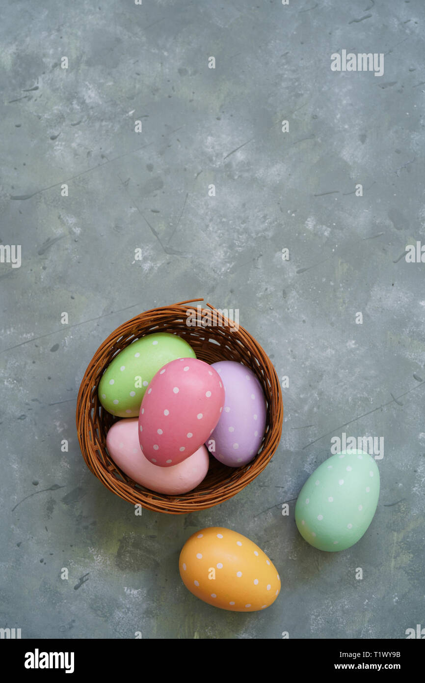 Multi colored Polka dots Easter eggs in a basket Stock Photo - Alamy