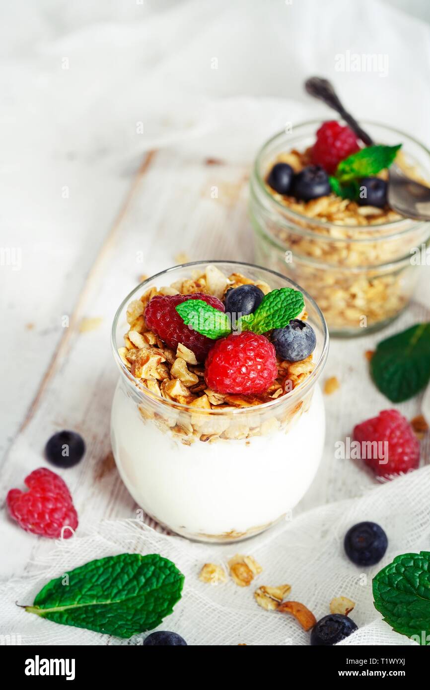 Healthy Breakfast Granola Yogurt Parfait with fresh fruits and berries ...