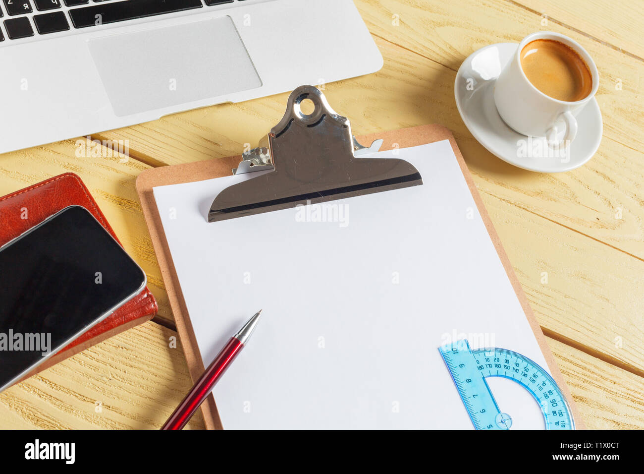 Office table background with coffee cup, pencils and computer keyboard ...