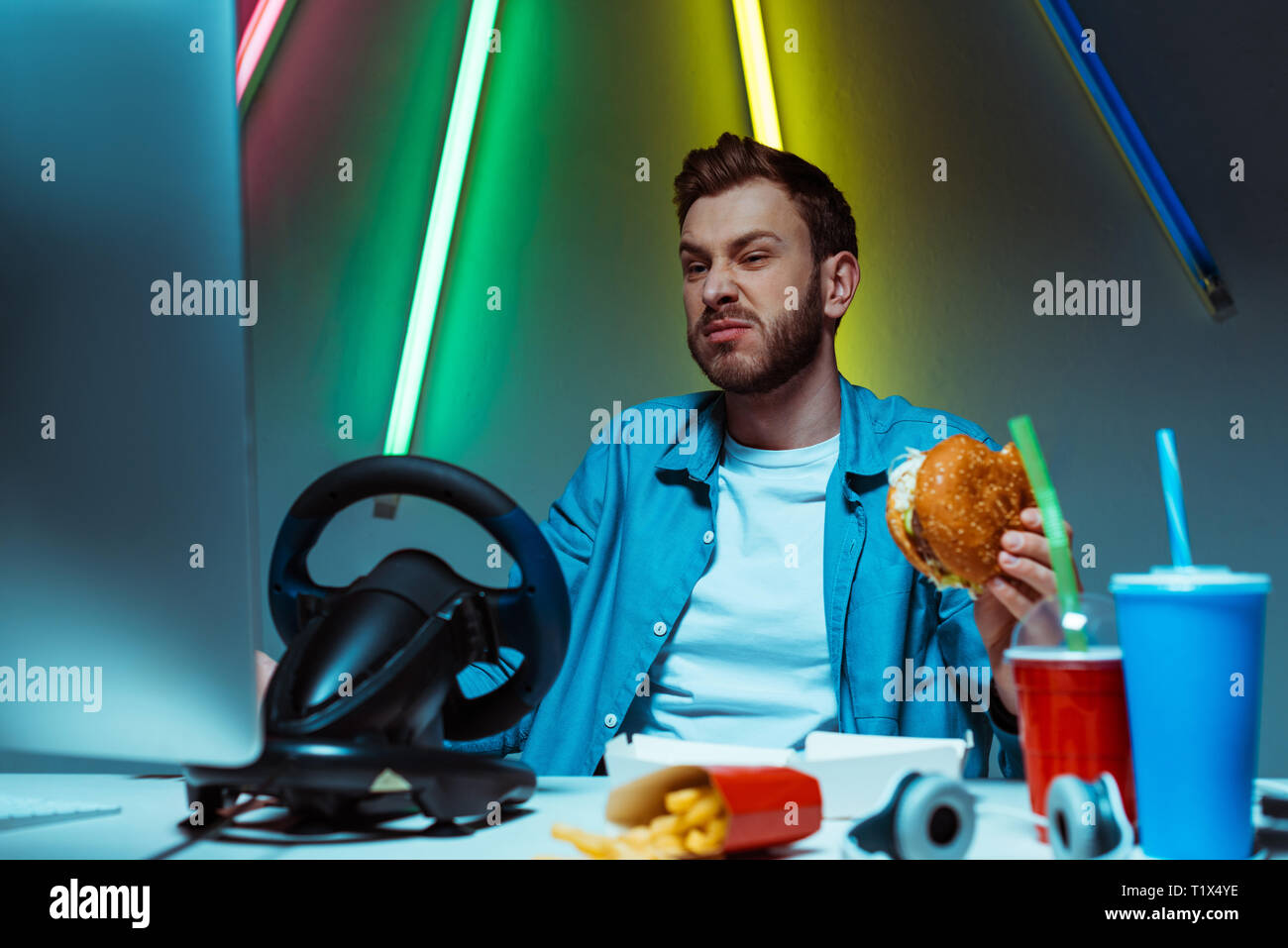 Young man computer monitor drinks hi-res stock photography and images ...