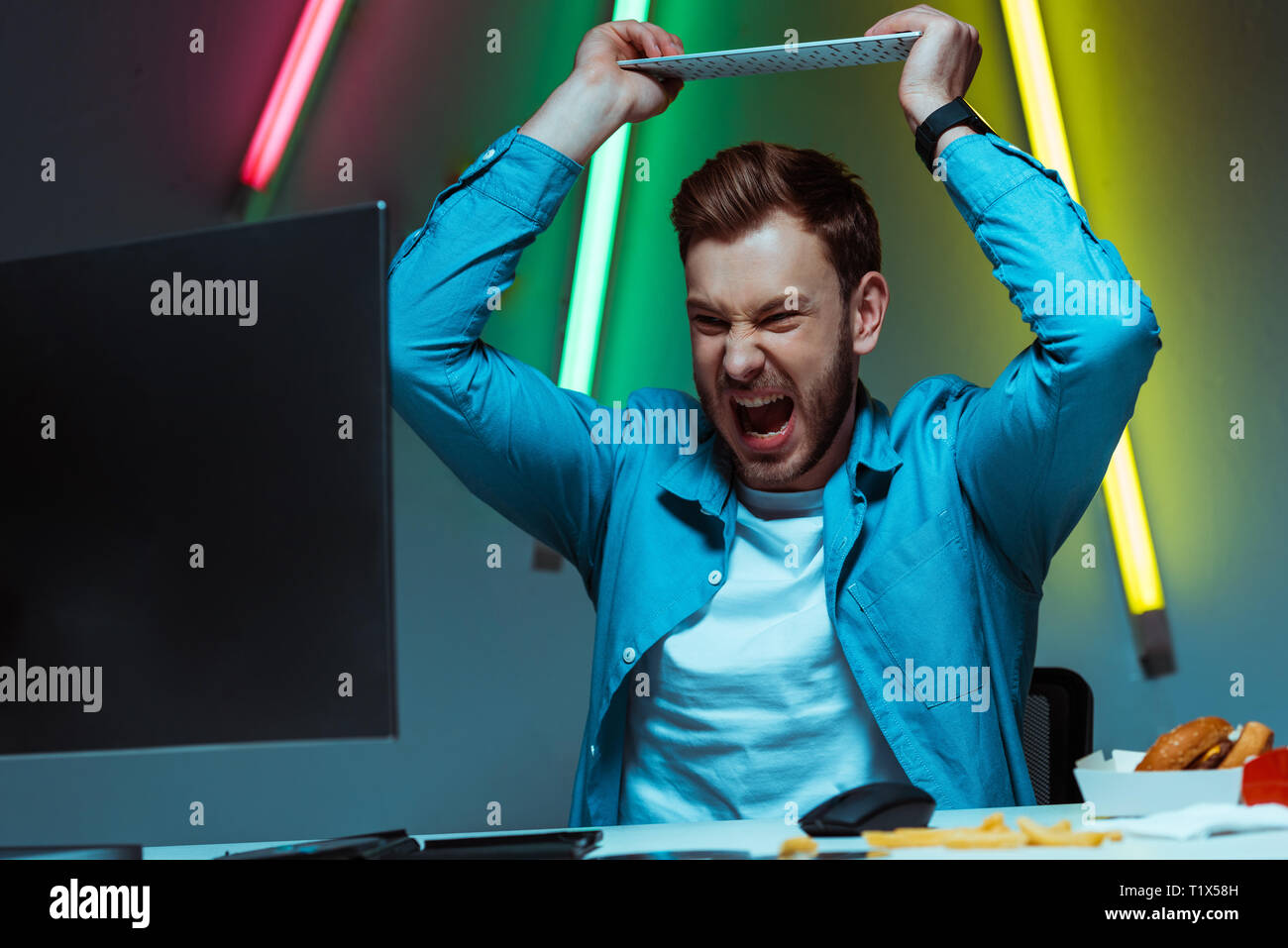 Angry man at computer hi-res stock photography and images - Alamy