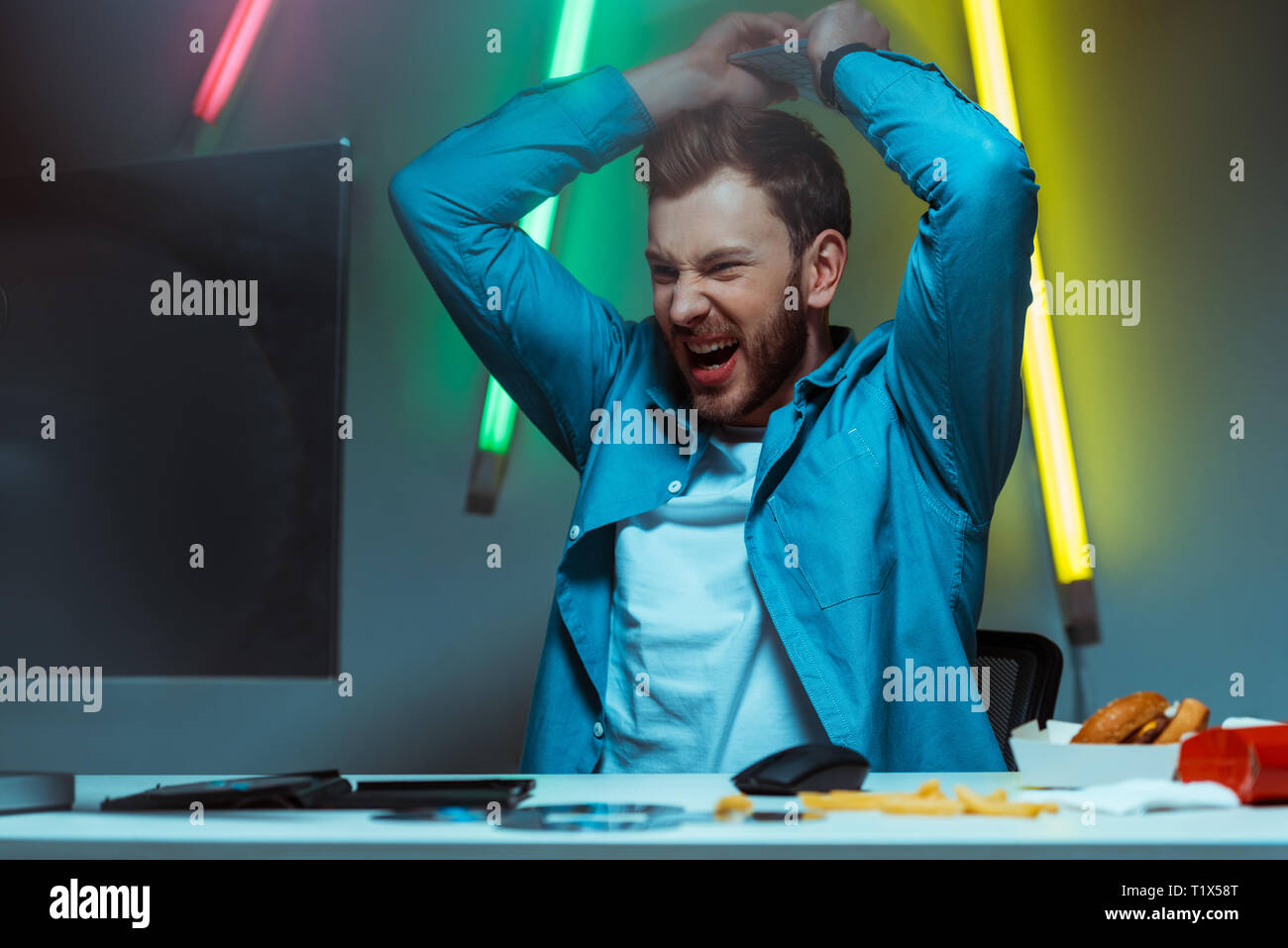 Angry man at computer hi-res stock photography and images - Alamy