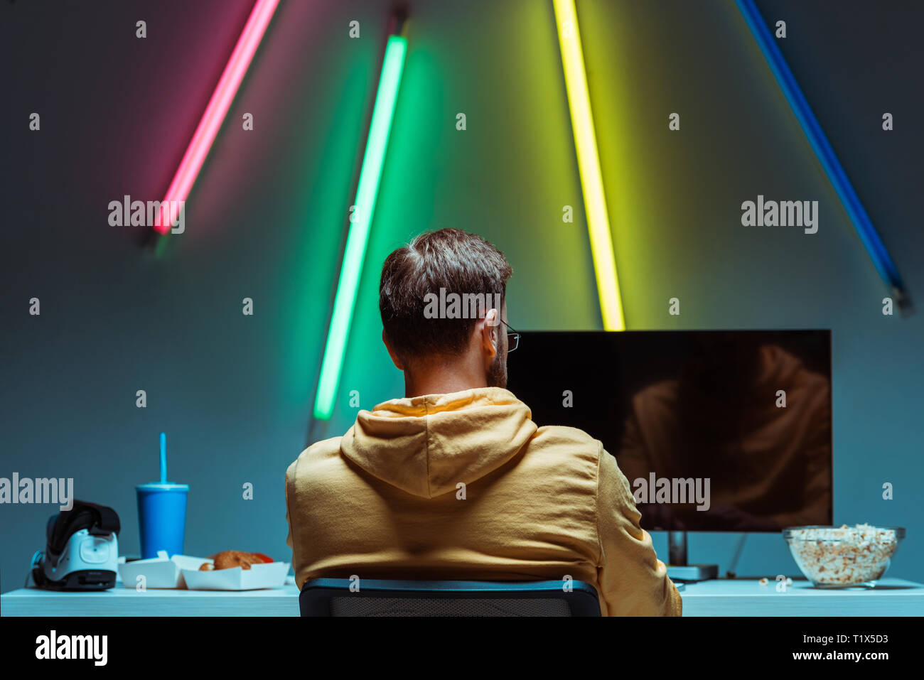Neon man looking computer screen hi-res stock photography and images ...