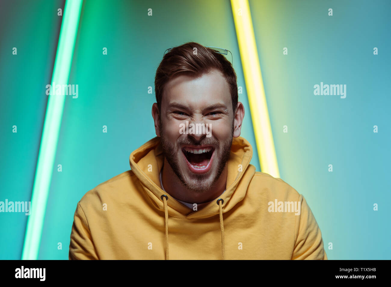 happy, handsome and screaming man looking at camera Stock Photo - Alamy