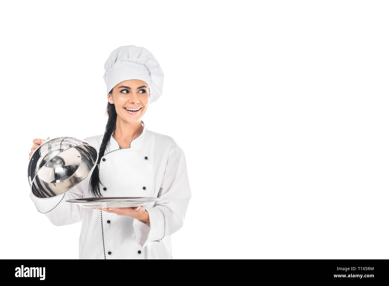 Smiling chef in hat holding tray with cloche isolated on white Stock ...