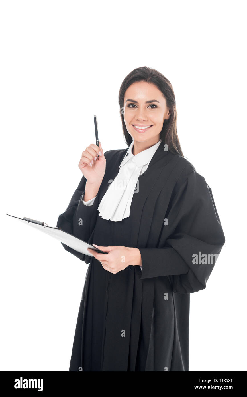 Smiling judge in judicial robe holding clipboard and pen isolated on ...
