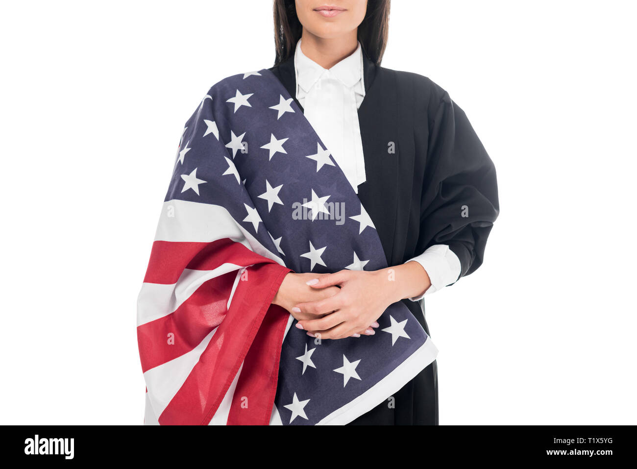 Cropped view of judge in judicial robe holding american flag isolated ...