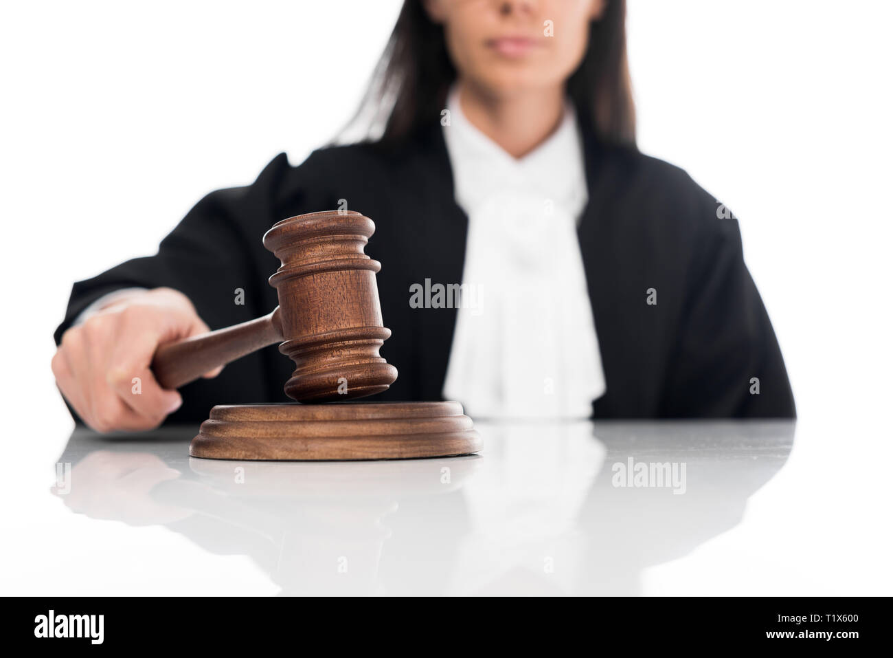 Partial view of judge in judicial robe holding gavel isolated on white ...