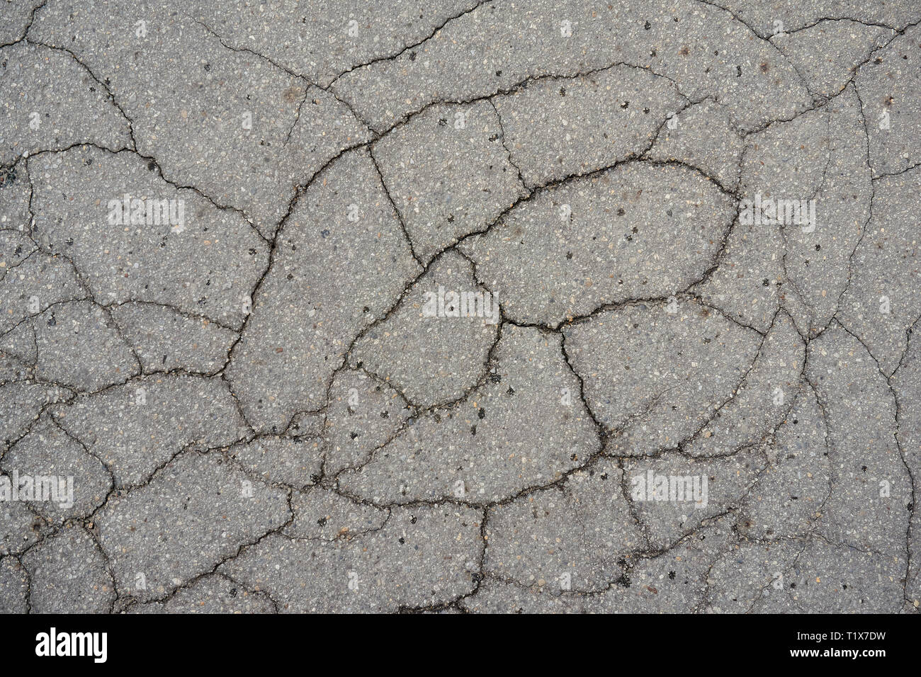 destructed tar road in a town Stock Photo - Alamy