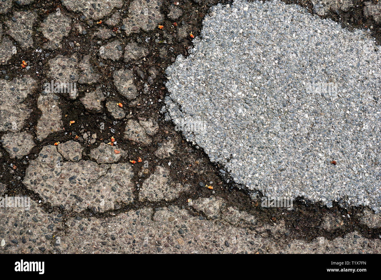 destructed tar road in a town Stock Photo - Alamy