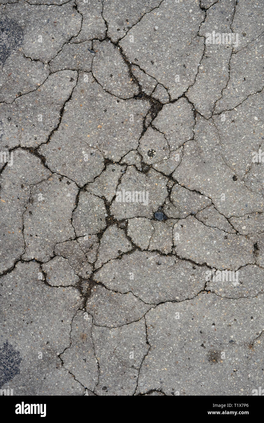 destructed tar road in a town Stock Photo - Alamy