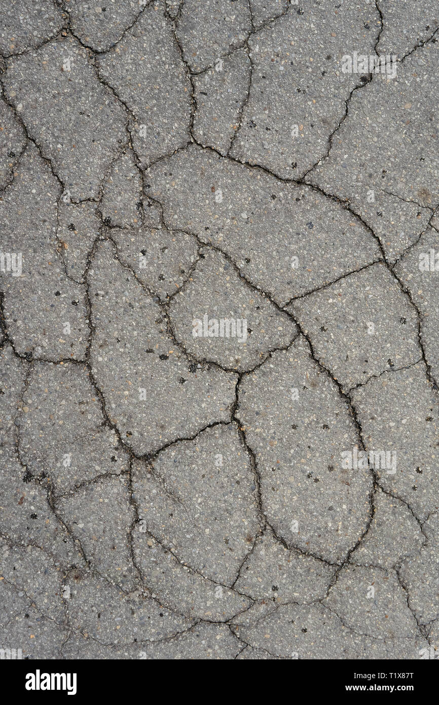 destructed tar road in a town Stock Photo - Alamy