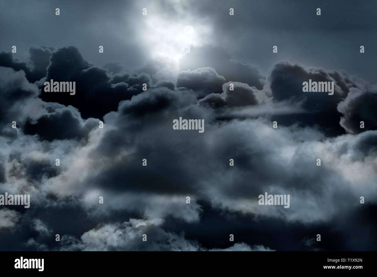 Above the clouds in a covered full moon night Stock Photo - Alamy