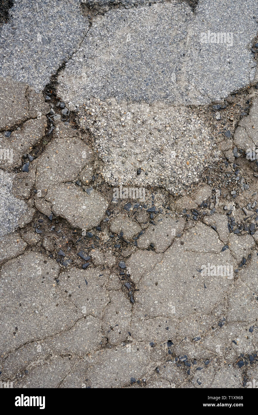 destructed tar road in a town Stock Photo - Alamy