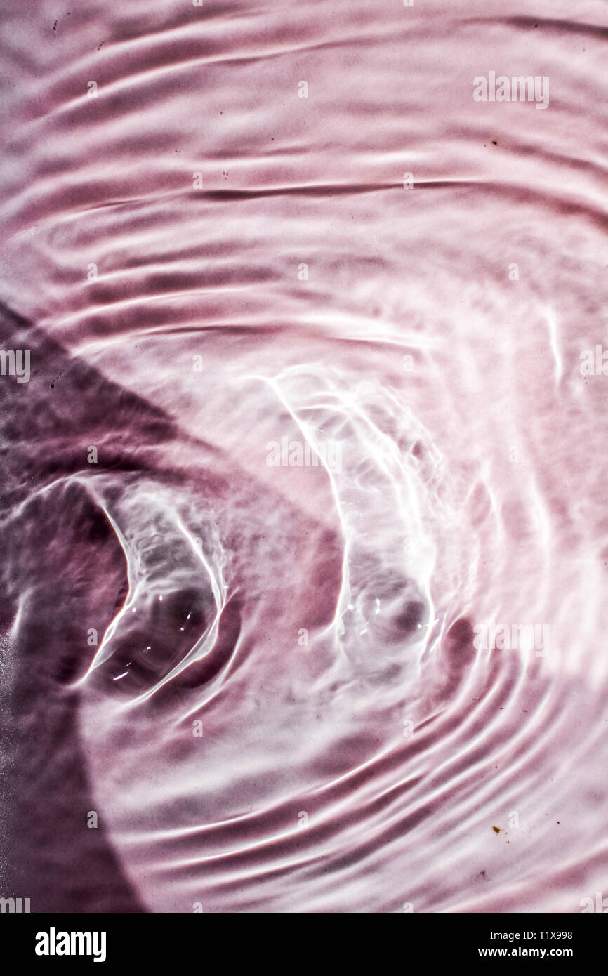 Pink flowing water texture as an abstract background - colourful ...