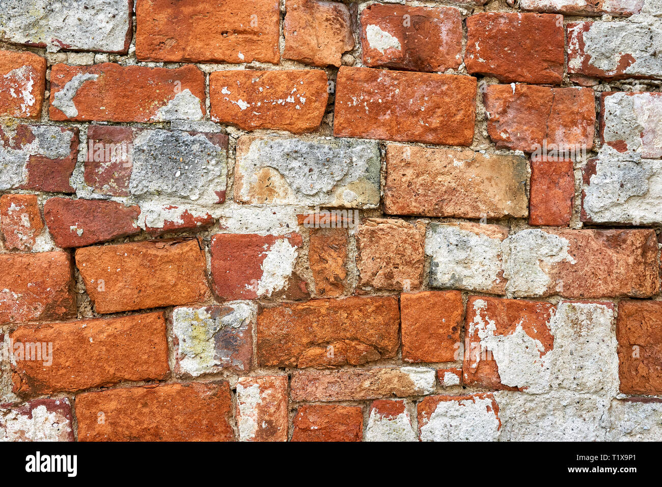 old repaired wall with brick texture Stock Photo - Alamy