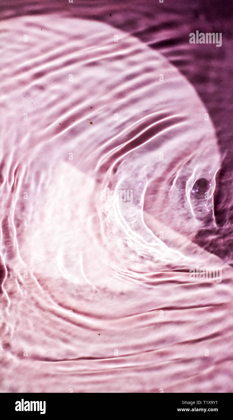 Pink flowing water texture as an abstract background - colourful ...