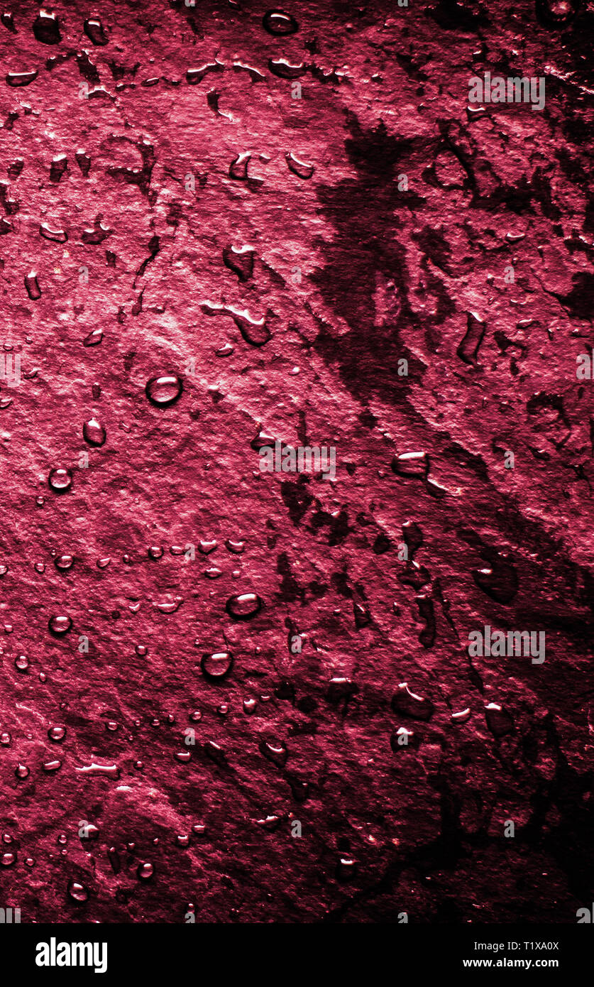 Liquid drops on old stone wall as an abstract background ...