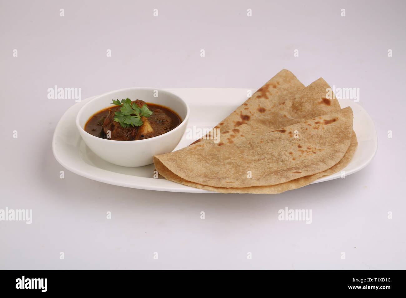 chappati with chicken curry Stock Photo - Alamy