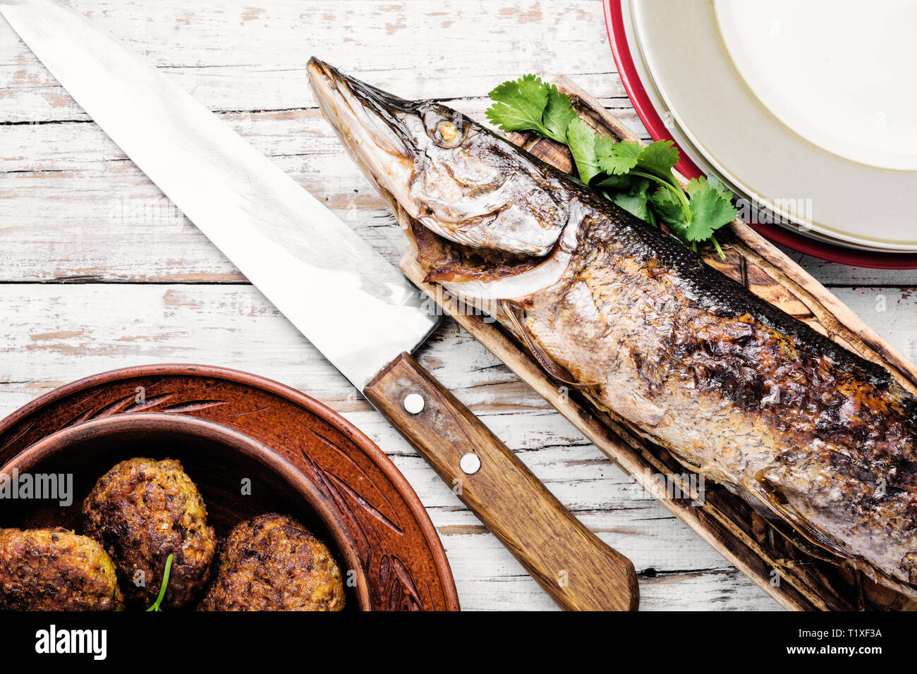 Baked grilled fish.Pike fish stuffed with mushrooms.Pike royally ...