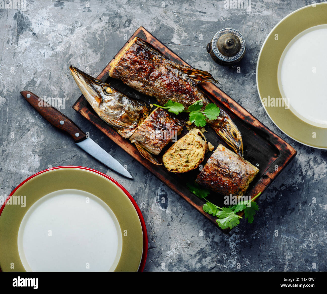 Baked grilled fish.Pike fish stuffed with mushrooms.Pike royally ...