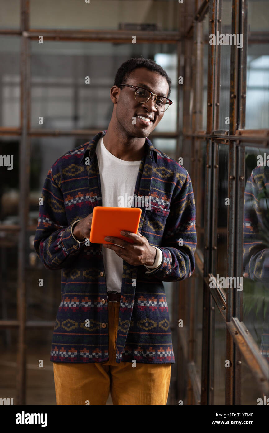 Man exploring new app on his tablet Stock Photo - Alamy