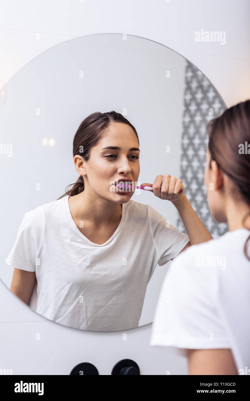 Woman brushing off skin hi-res stock photography and images - Alamy