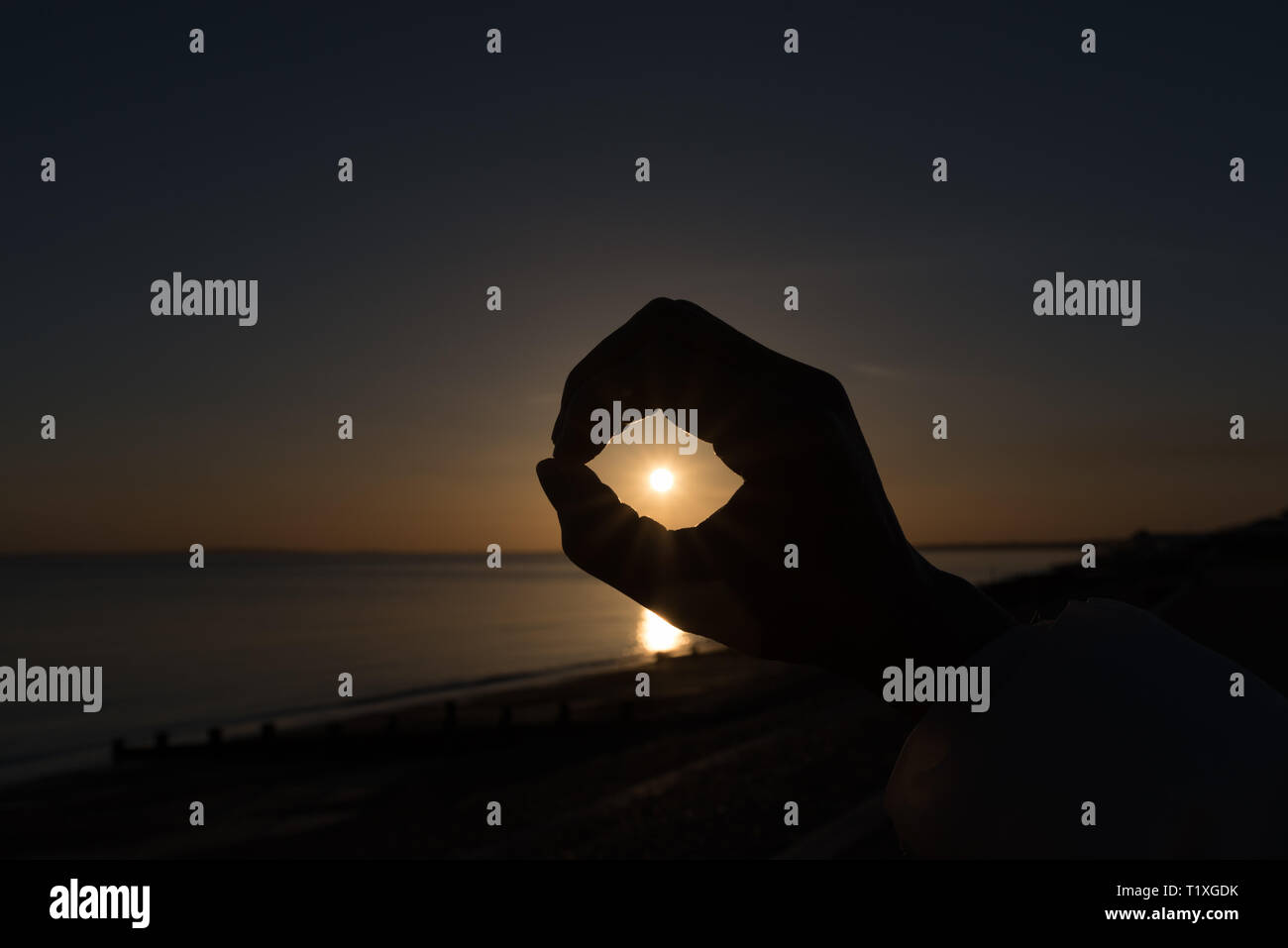 Sunset hands hi-res stock photography and images - Alamy