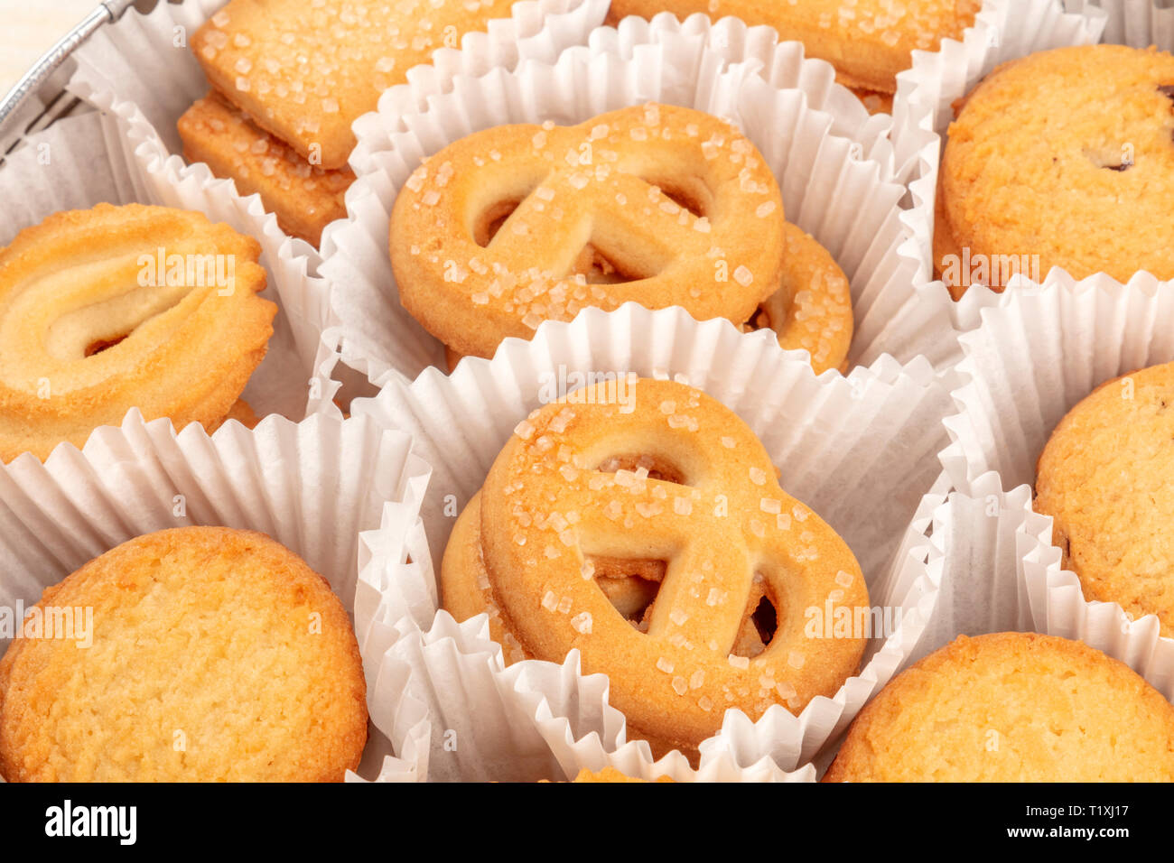 A closeup photo of Danish butter cookies in the traditional tin box ...