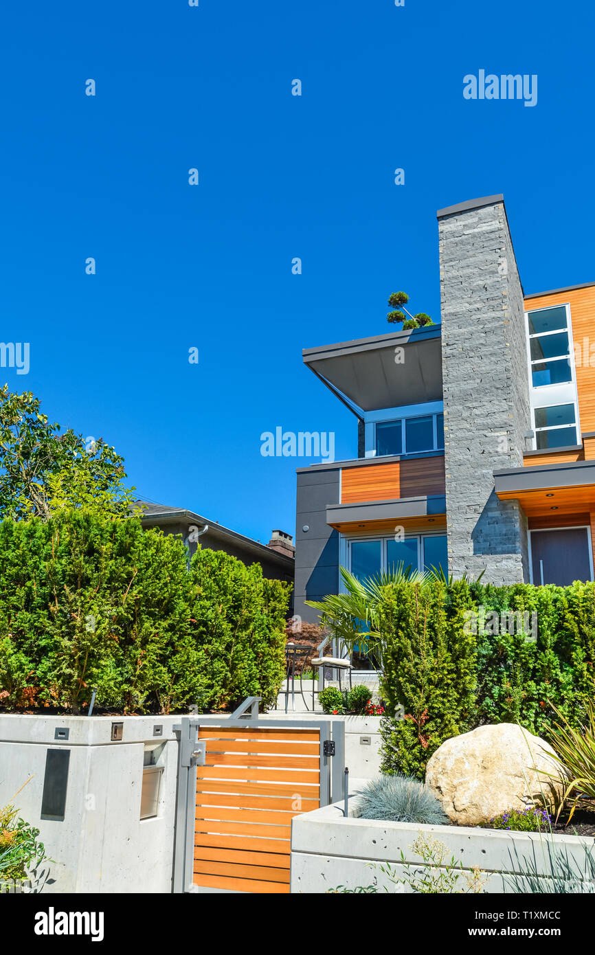Modern residential house with concrete terrace and wooden gate Stock ...
