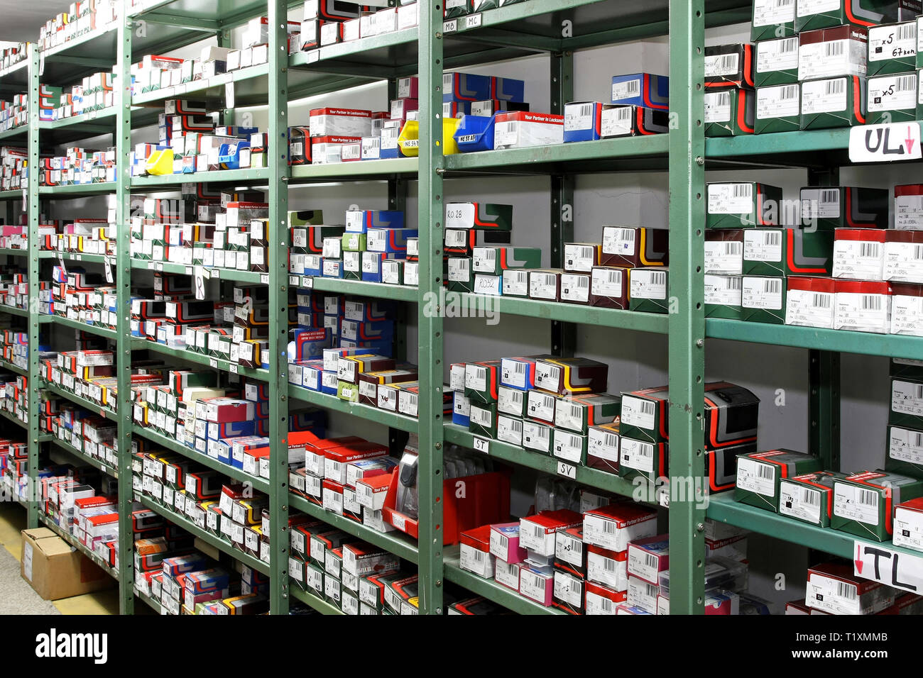 Big storage rack with lot of small boxes Stock Photo - Alamy