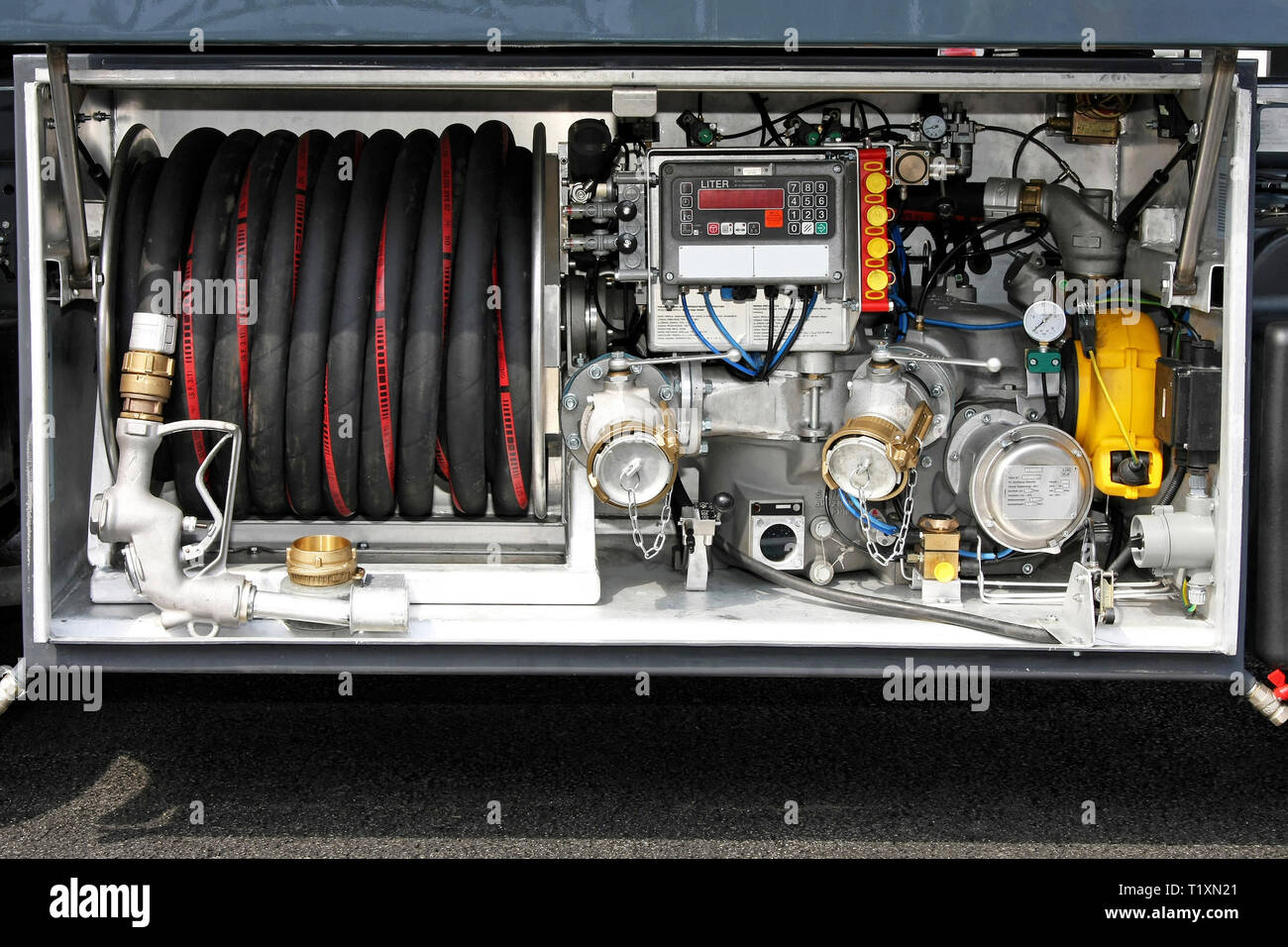 Oil pump with long hose for industry Stock Photo - Alamy