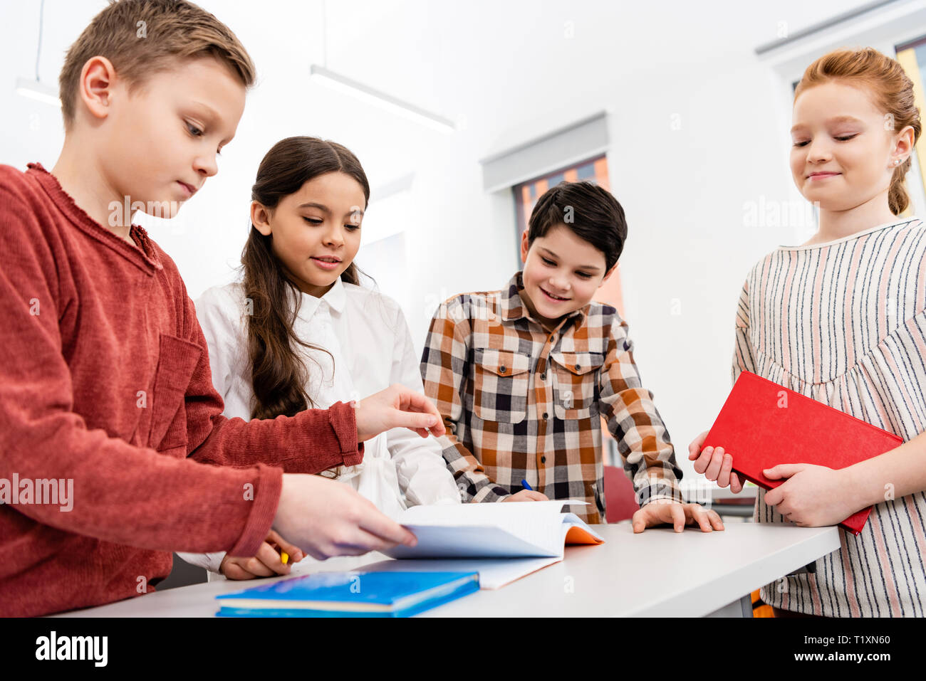 Schoolgirls classroom books hi-res stock photography and images - Alamy