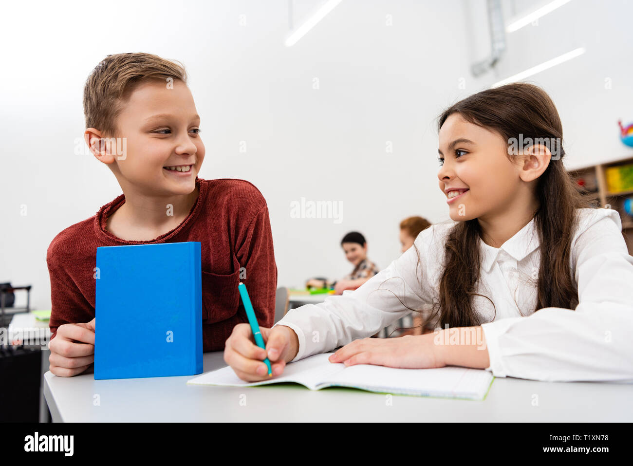 Classroom, talking, writing hi-res stock photography and images - Alamy