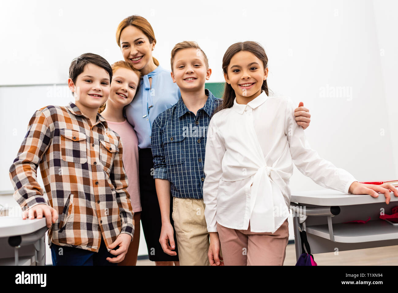 Children laughing teacher classroom hi-res stock photography and images ...