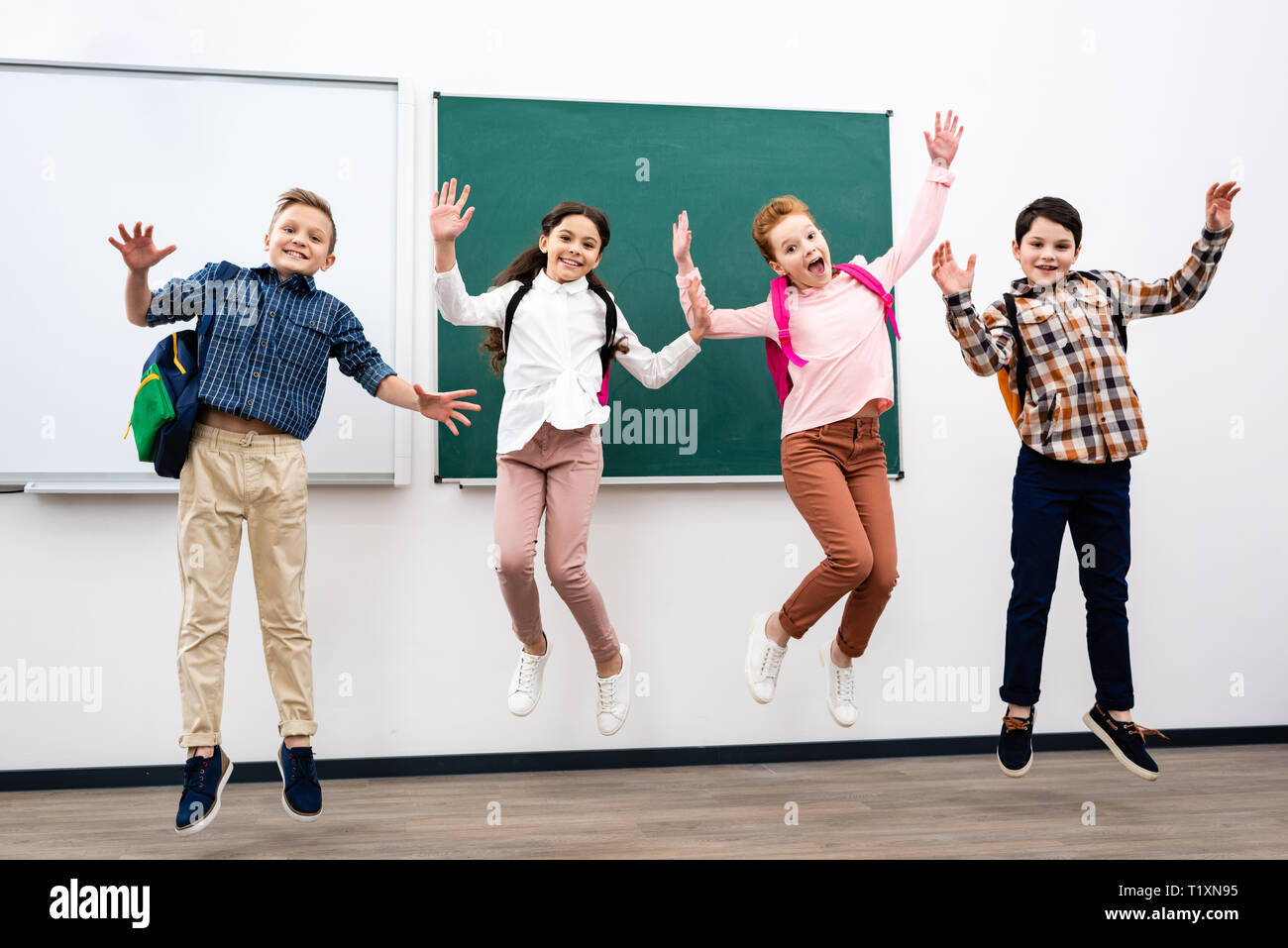 Children jumping classroom hi-res stock photography and images - Alamy