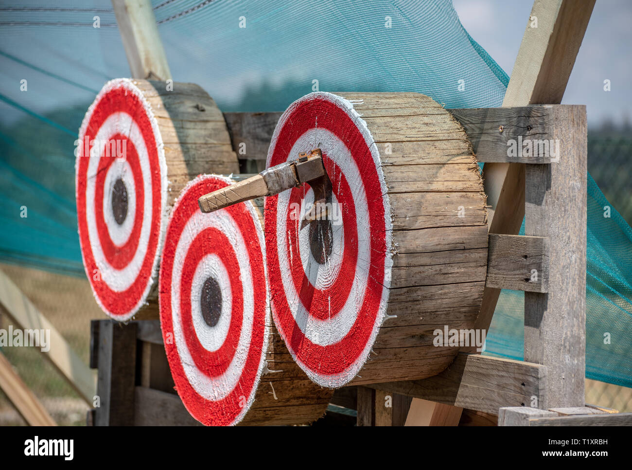 Axe flying to target center Stock Photo - Alamy