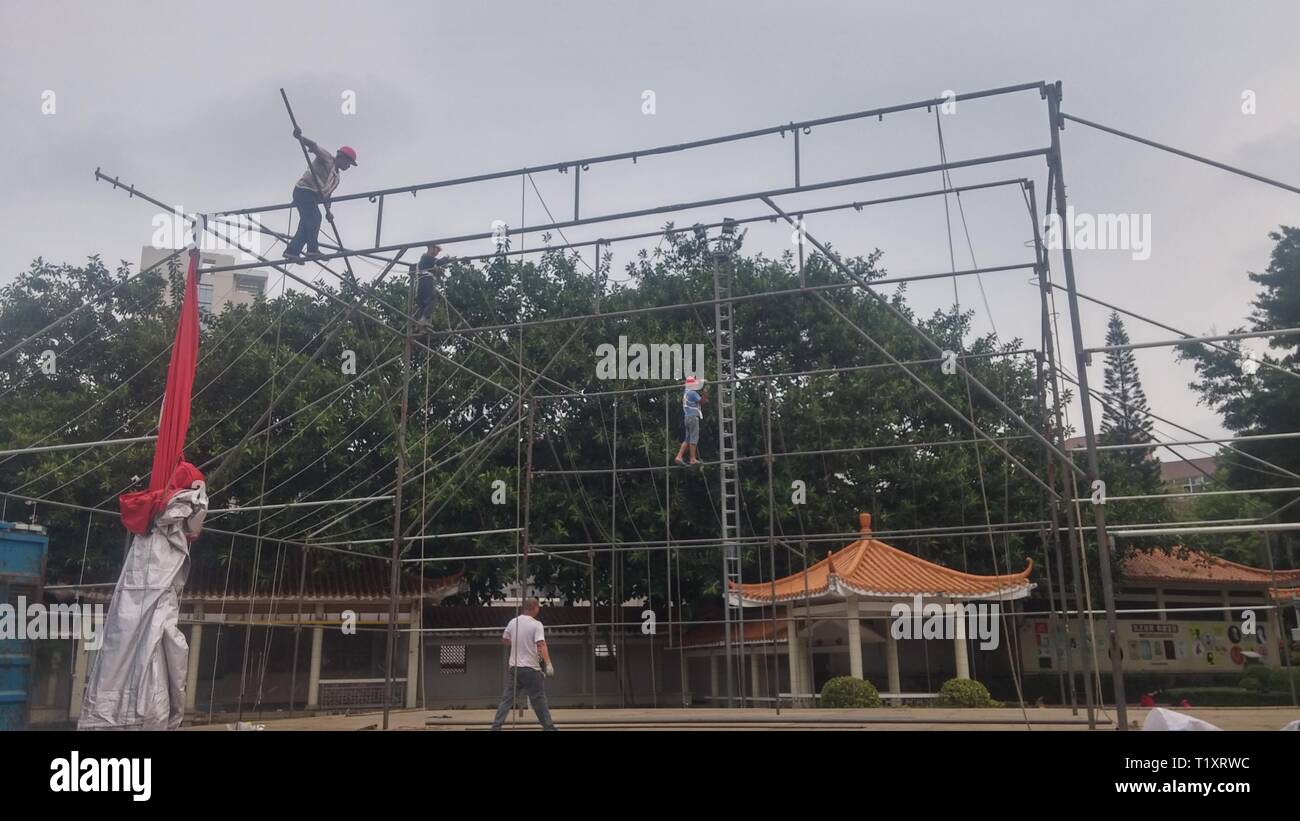 Shenzhen, China: Workers are setting up a stage to welcome the arrival ...