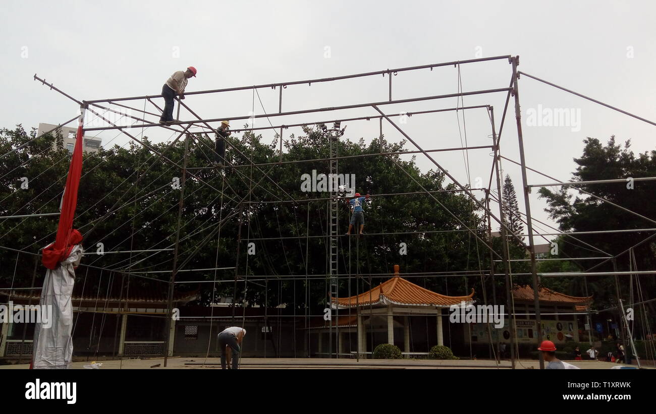 Shenzhen, China: Workers are setting up a stage to welcome the arrival ...